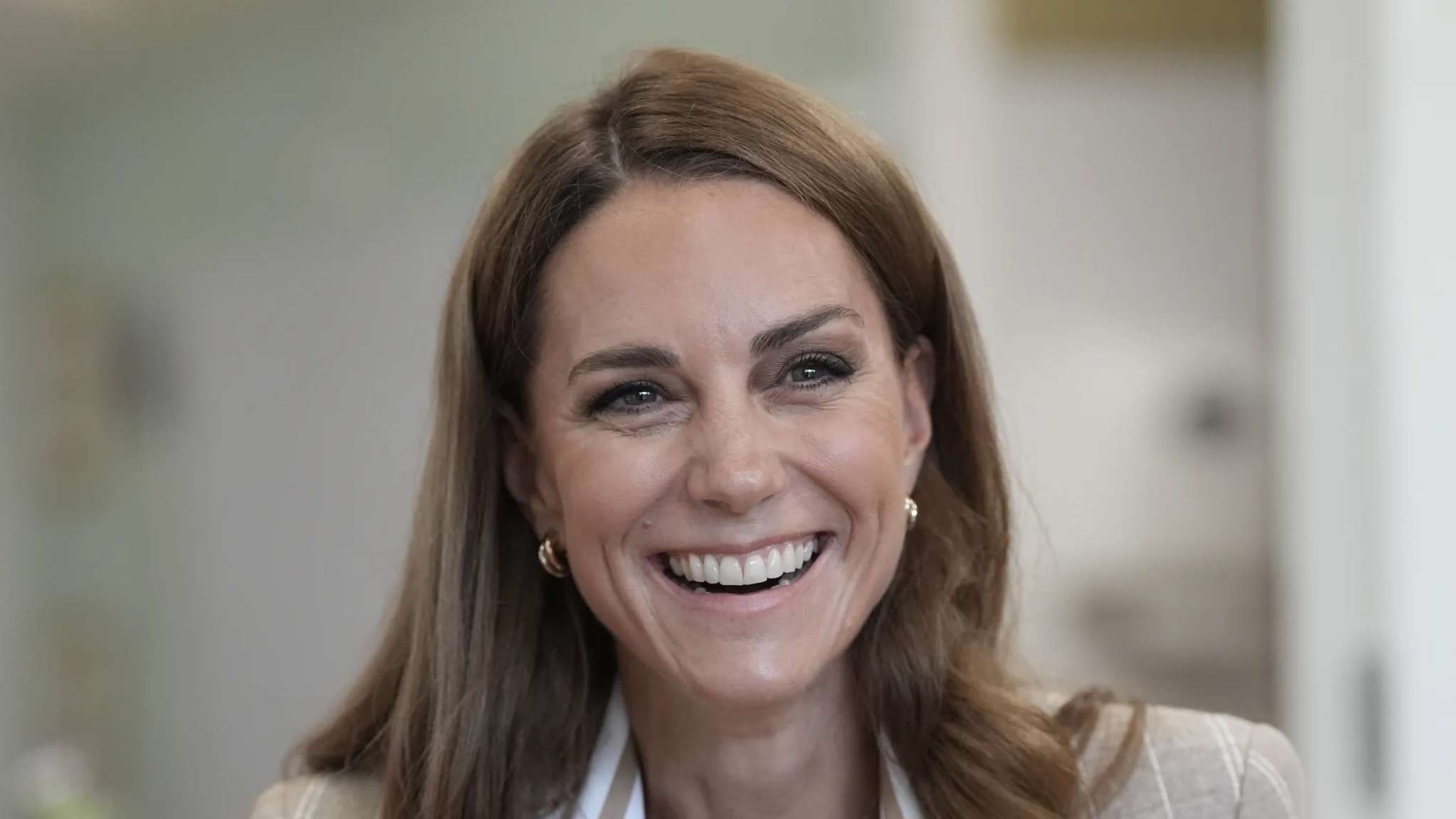 Kate Middleton in een gestreepte blouse, het item van de zomer